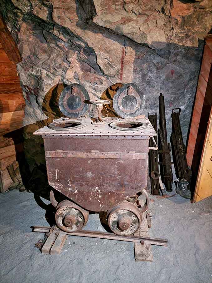 This vintage ore cart once hauled precious metals through darkness, now it hauls memories for curious modern explorers.