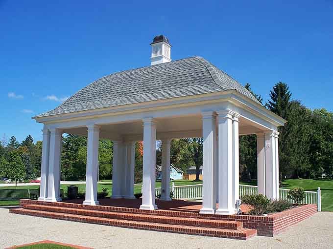 A proper white-columned gazebo standing tall in the park, because Chagrin Falls understands that beauty deserves a permanent address.