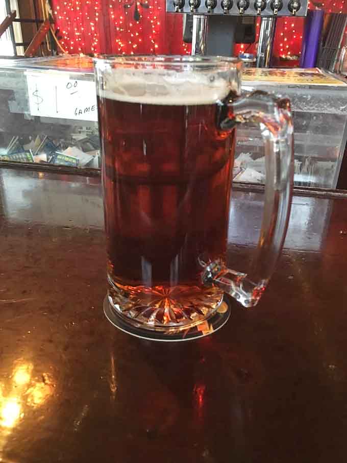 A cold beer at the bar, where the conversation flows as smoothly as the beverages.
