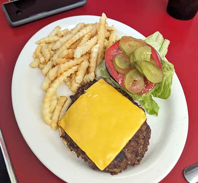 A cheeseburger and fries so classic, so perfect, they could teach a masterclass in being themselves.