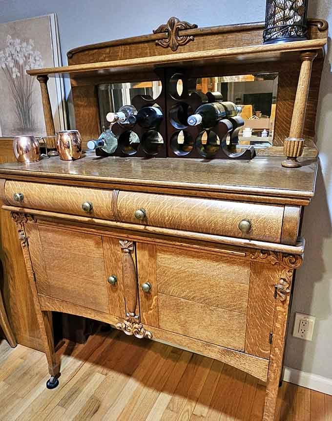 An Empire-style sideboard that's fancier than most people's entire dining rooms combined, no exaggeration here.