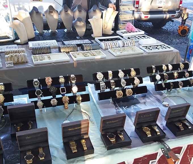 Watches and jewelry glisten under careful display, offering wrist candy that looks expensive but won't require a payment plan.