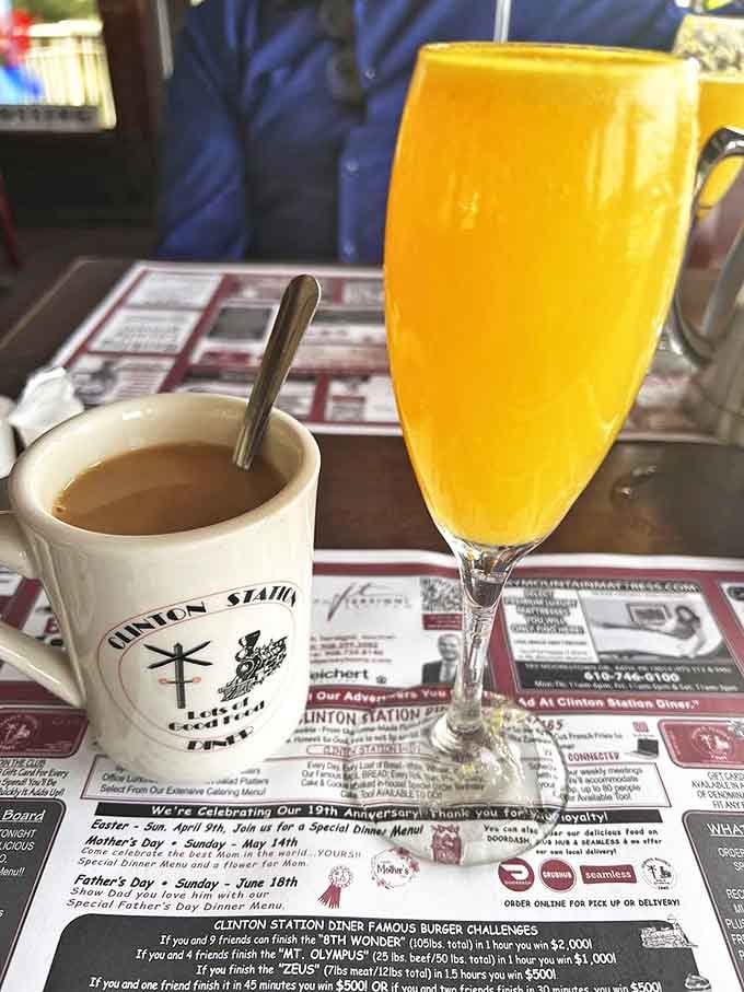 Coffee and a mimosa sit together like the breakfast dream team, covering both your caffeine and brunch requirements perfectly.
