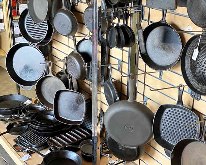 Cast iron skillets hang like kitchen trophies, ready to outlast any modern non-stick pan by decades.