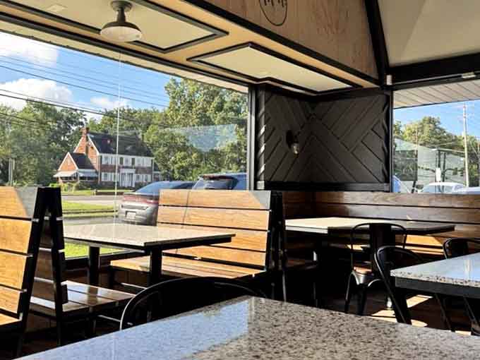 Natural light floods the dining area, making every bite of chicken look even more appetizing somehow.