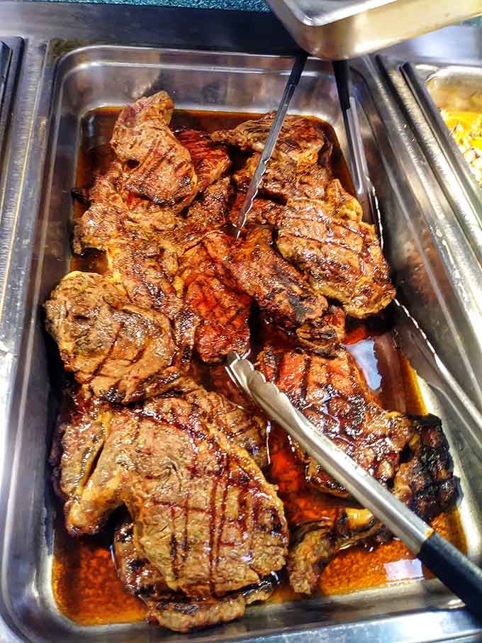 Grilled steaks glistening in their own juices, waiting patiently to become someone's protein-packed dream come true right now.
