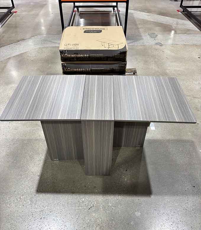 A foldable table that's probably more organized than it will ever be again once someone takes it home.