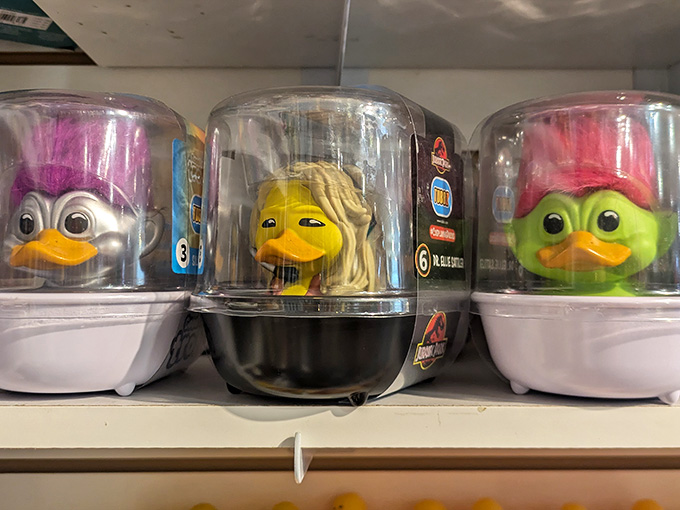 Ducks with wild hair colors sit in their little containers like they're waiting for a punk rock bath time concert.