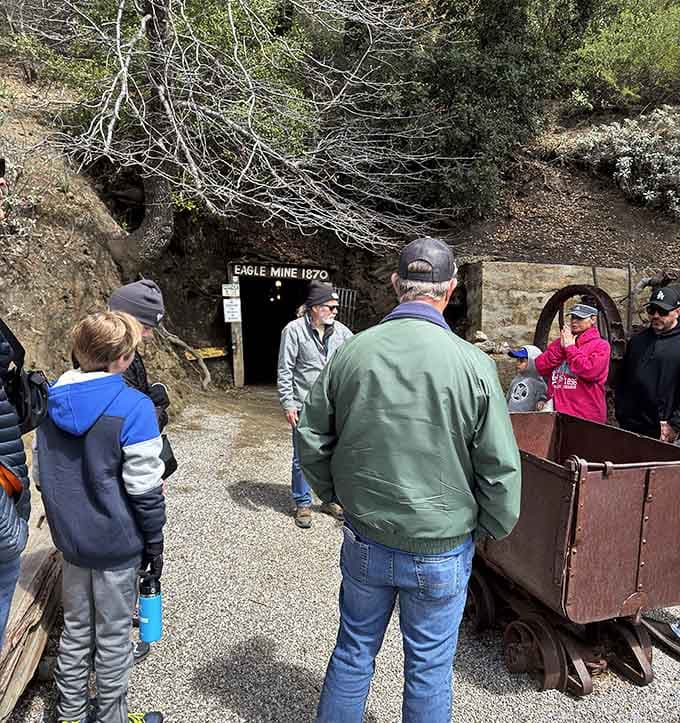 Tour groups gather outside the entrance, trading air conditioning and WiFi for authentic history and genuine underground exploration.