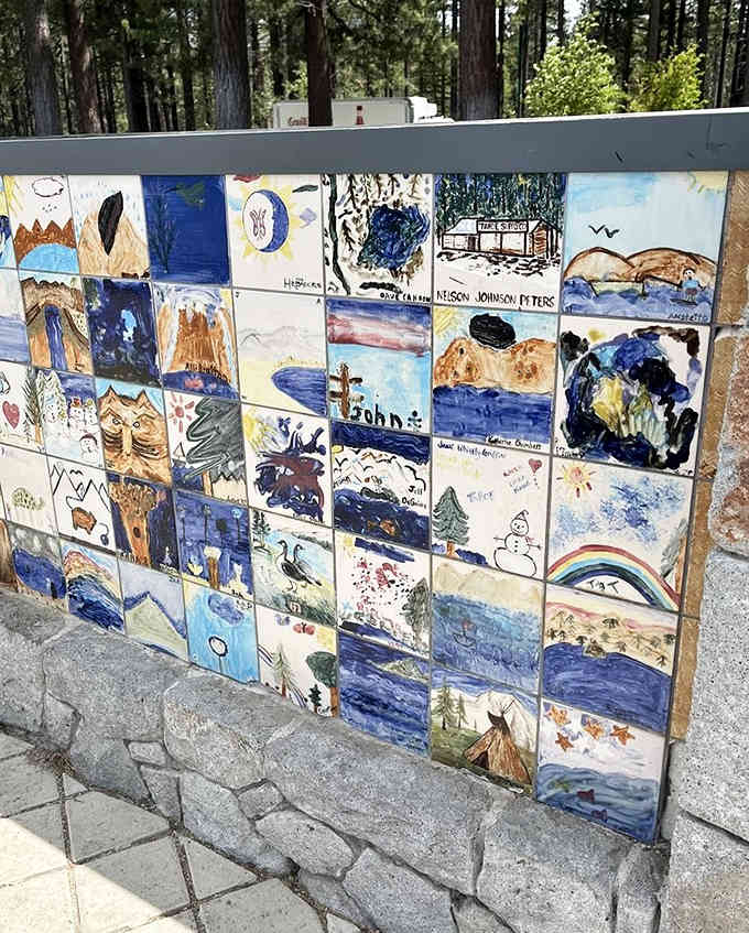 Local artists transform tiles into a community mosaic celebrating lake life in colorful detail.