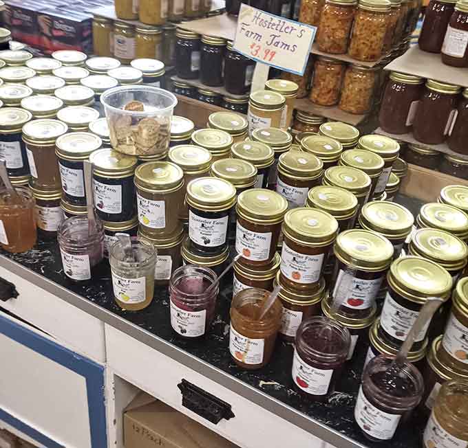 Rows of homemade jams showcase local flavors, each jar representing someone's kitchen labor of love.