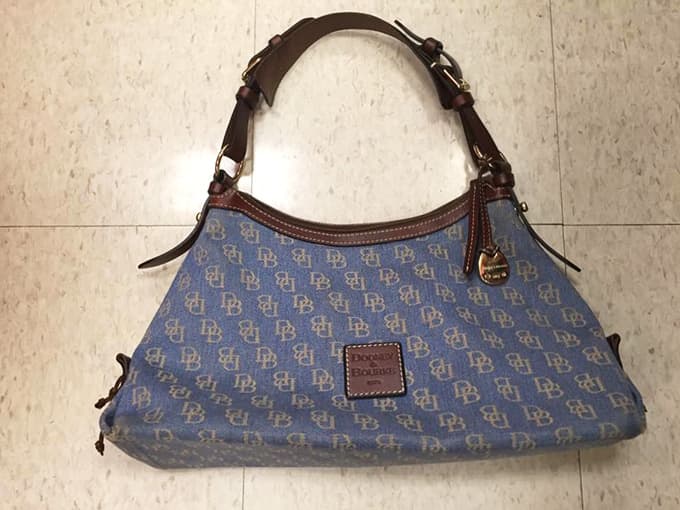 A Dooney and Bourke bag, just sitting there on the floor, waiting for someone smart to notice it.
