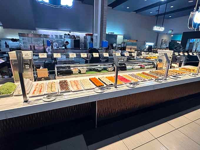 The sushi bar stretches out like an edible rainbow, offering fresh rolls for your grazing pleasure all day.