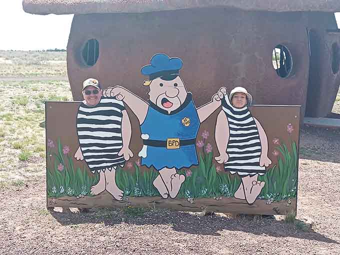 Stick your head through and become an honorary Bedrock citizen, captured forever in striped prisoner glory.