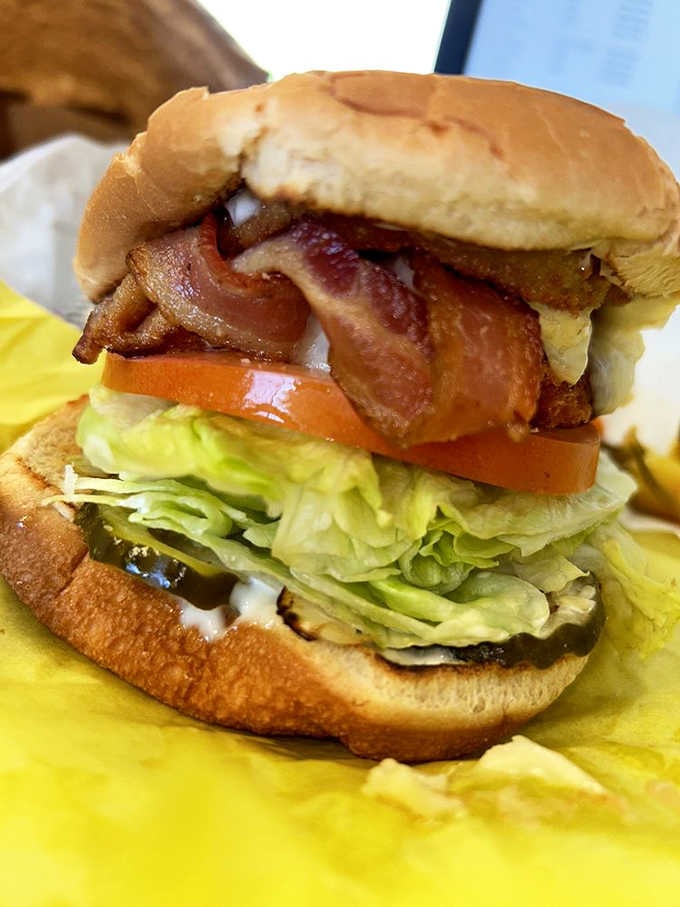 Crispy bacon, fresh tomato, and a fluffy bun create the kind of burger that fuels your ice cream run.