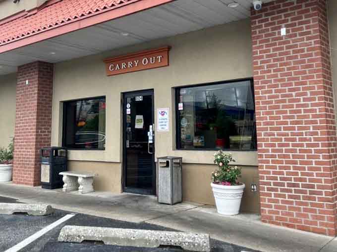 The carryout entrance proves you can take paradise home, though eating here feels more special.