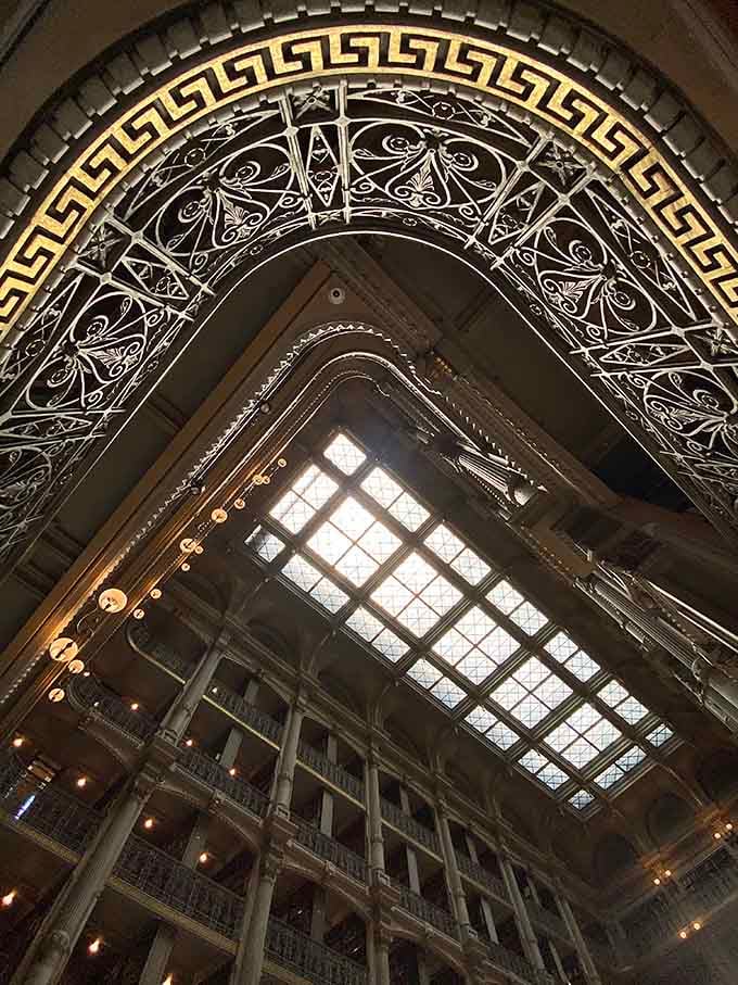 Looking up through ornate ironwork feels like gazing into a kaleidoscope designed by architectural geniuses with unlimited budgets.