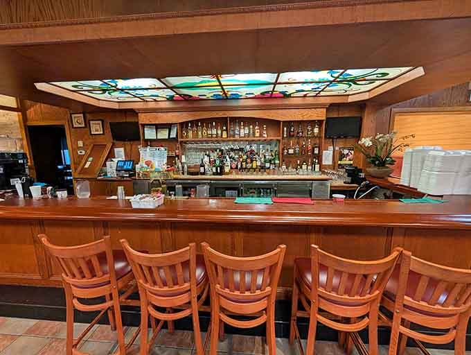 A full bar with stained glass accents adds unexpected elegance to your all-you-can-eat dining adventure today.