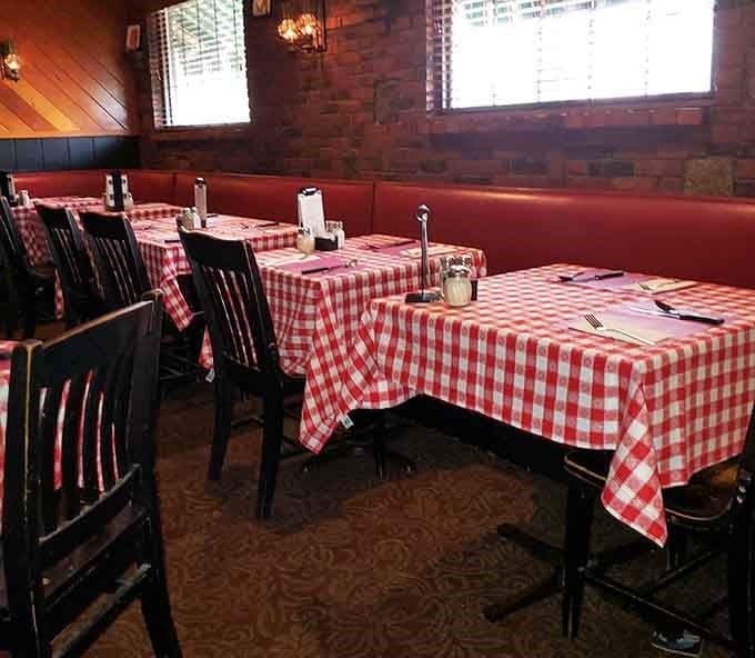 Multiple tables set with those iconic checkered cloths, ready to host everything from first dates to fiftieth anniversaries.