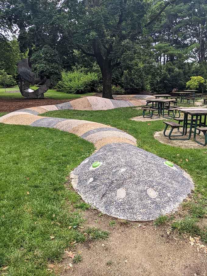 Sleek sculptures flanking a peaceful pathway create the kind of zen moment that makes you forget your phone exists.