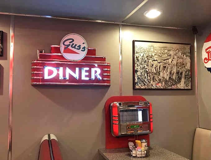 That illuminated diner sign and jukebox combo is basically a time machine you can photograph.