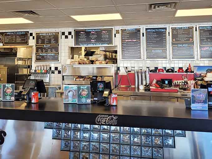 The counter area gleams with promise, where dreams are ordered and hunger meets its delicious, inevitable defeat.