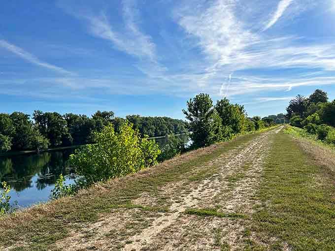 This peaceful riverside path is nature's way of saying your daily constitutional just got a serious upgrade.