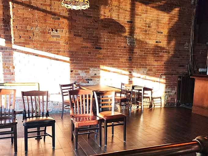 Comfortable seating bathed in natural light invites lingering conversations over plates of exceptional seafood delights.