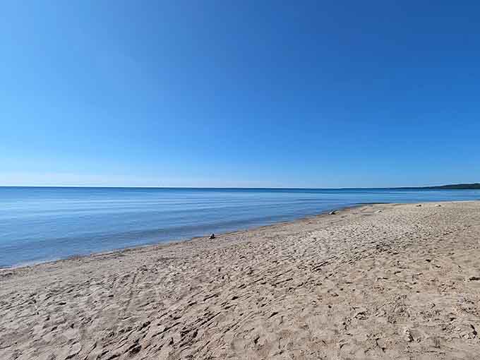 Endless beach and endless sky meet at the horizon, creating that postcard moment you'll want to capture forever.