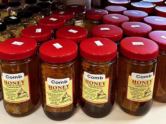 Comb honey jars line up like golden soldiers, each one containing pure mountain sweetness worth savoring.