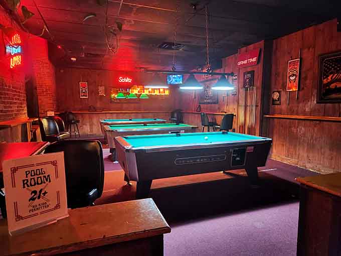 The pool room glows red like a scene from a really delicious movie about people having the best time ever.