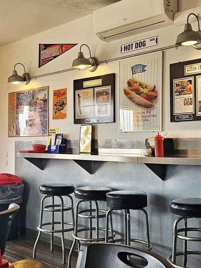 Vintage signs and hot dog memorabilia create a nostalgic atmosphere where every meal comes with a side of memories.