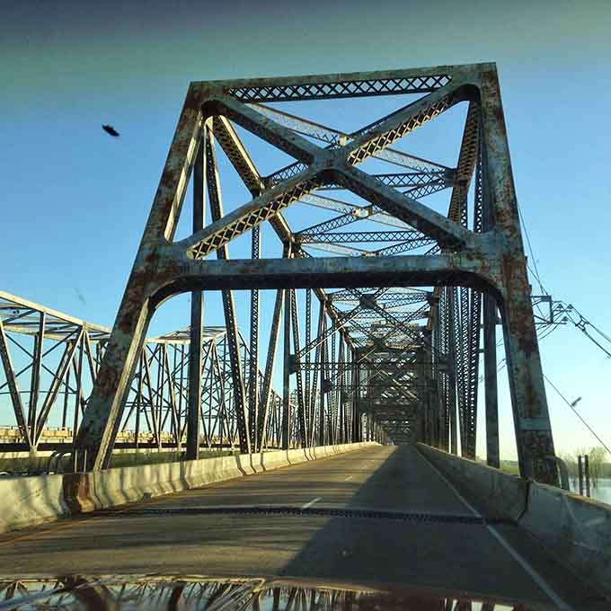 Henderson's historic bridge stands as a testament to engineering beauty, connecting past and present with weathered steel grace.