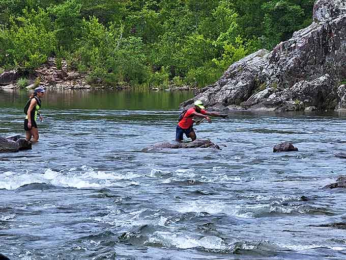 Adventurous souls navigate the rocky channels, proving that natural water parks beat manufactured ones every time.