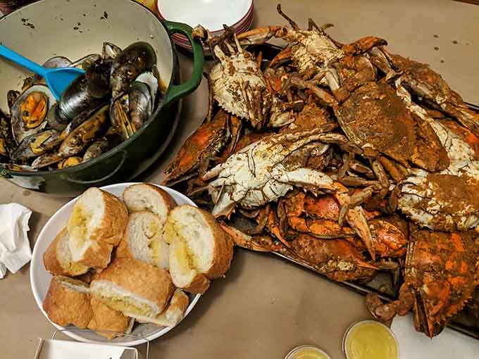 This glorious spread of crabs, mussels, and bread looks like the Last Supper, but way more delicious and messy.