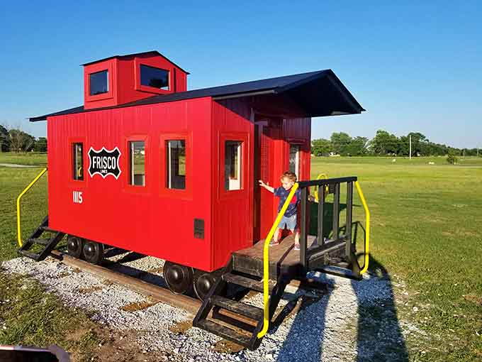 A bright red Frisco caboose turned into a playset. Kids love it and train enthusiasts quietly love it too.