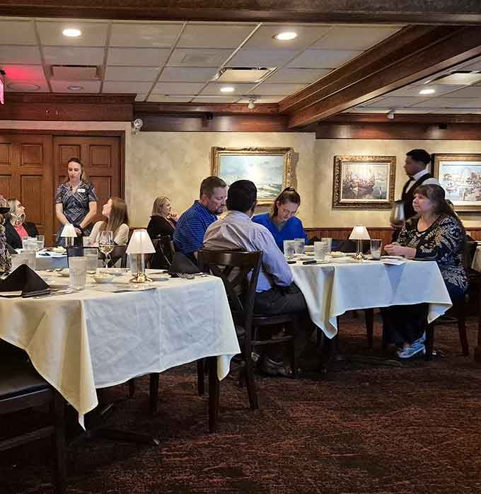Real people enjoying real steaks in a dining room that feels both special and wonderfully unpretentious at once.