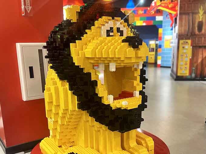 This magnificent lion roars silently, constructed from thousands of bricks by someone with supernatural patience.