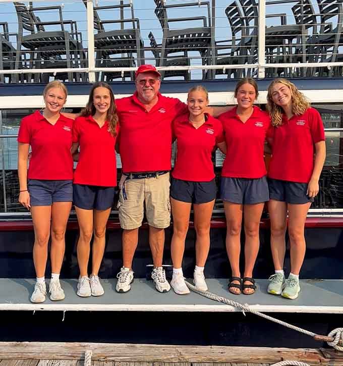 The friendly crew in their signature red polos, making sure every passenger's experience is absolutely first-rate.
