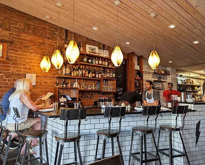 The bar offers front-row seats to pizza theater, complete with Italian wines and local brews.