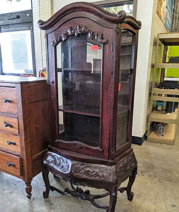This ornate display cabinet has seen things and stored things, and it's ready for its next chapter.