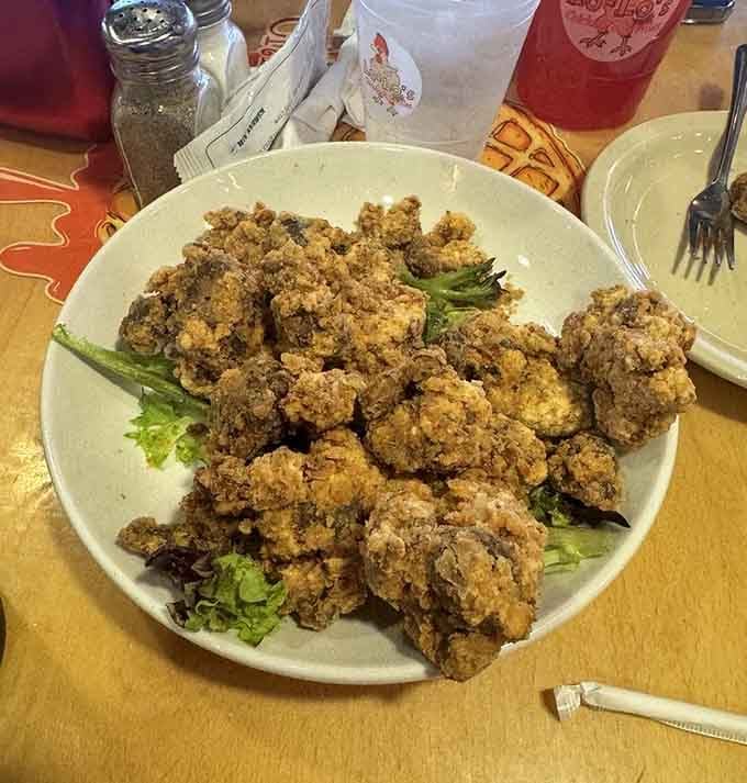 Fried gizzards piled high like edible gold nuggets for the adventurous soul food enthusiast within you.
