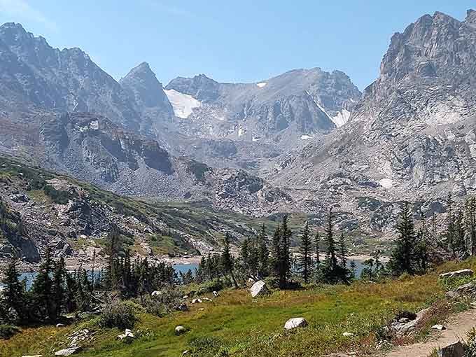 Rocky peaks tower above the lake like nature's own cathedral, inspiring awe without requiring a donation.