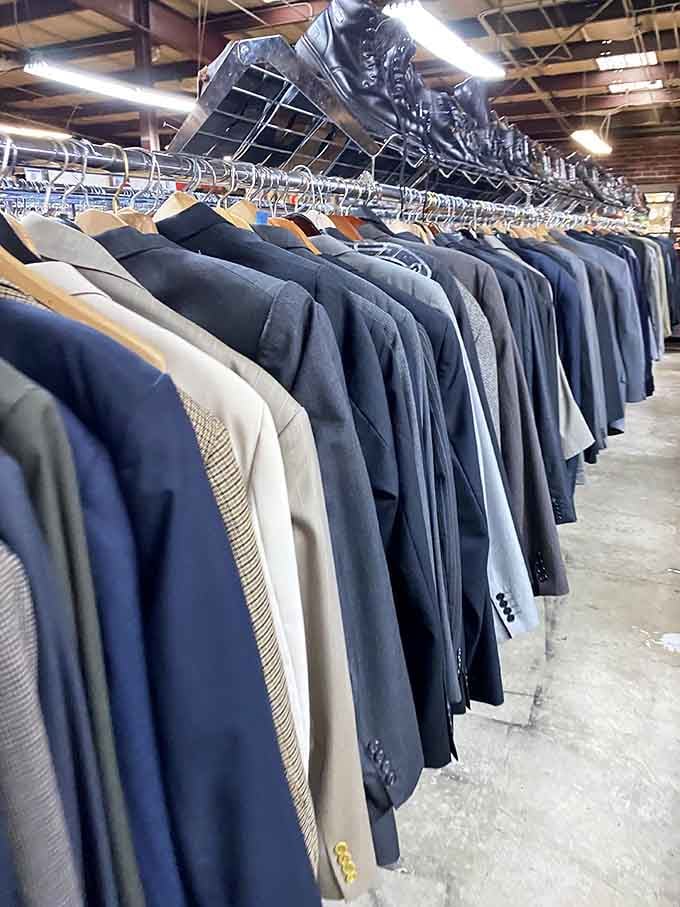 Men's suits lined up like a corporate army, ready to outfit your next job interview on a budget.