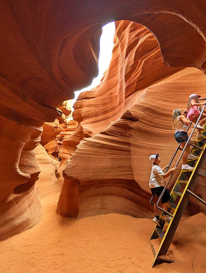 Visitors navigate the narrow passages, cameras ready to capture what words consistently fail to describe adequately.