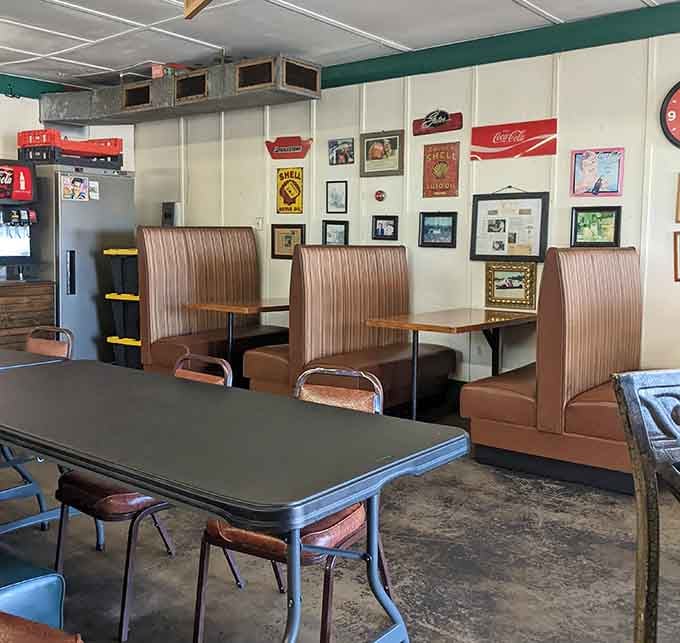 Classic diner booths adorned with Coca-Cola memorabilia create the perfect setting for memorable meals together.