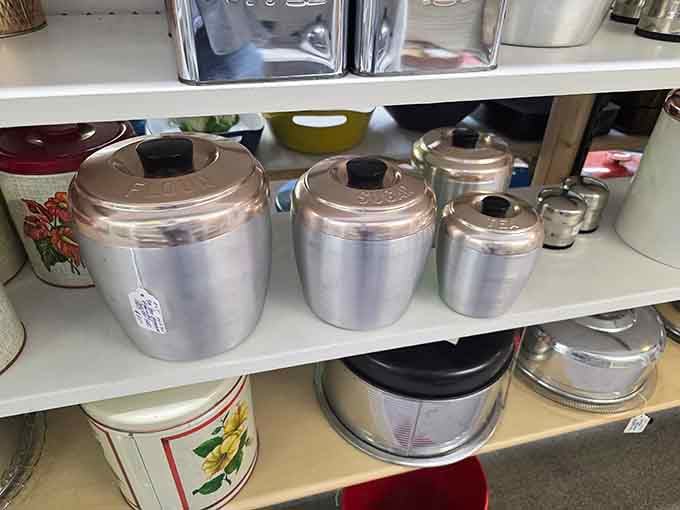 Vintage aluminum canisters gleam like they're auditioning for a role in a 1950s kitchen magazine spread.