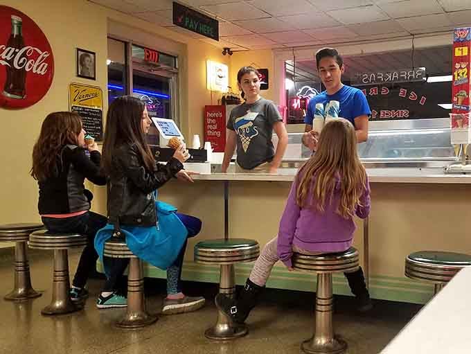 The next generation learns an important life lesson: ice cream makes everything better, especially at Marion's counter.