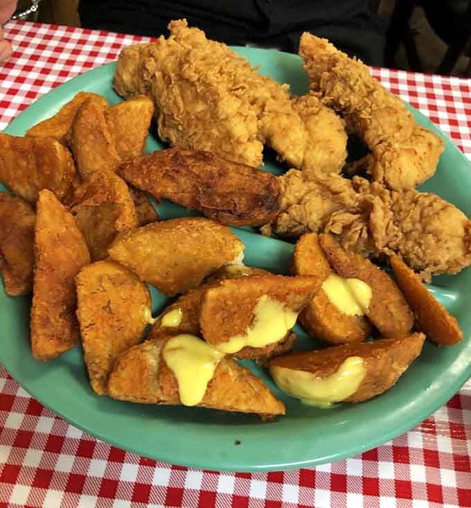 Chicken tenders and crispy potato wedges piled high. Sometimes simple preparations yield the most satisfying results.