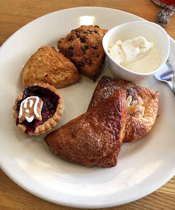 Fresh-baked pastries arranged like edible artwork, each one calling your name louder than the last, resistance absolutely futile here.